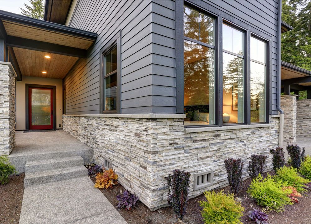 Stone Veneer Foundation Is Adding Stone Veneer To The Outside Of A
